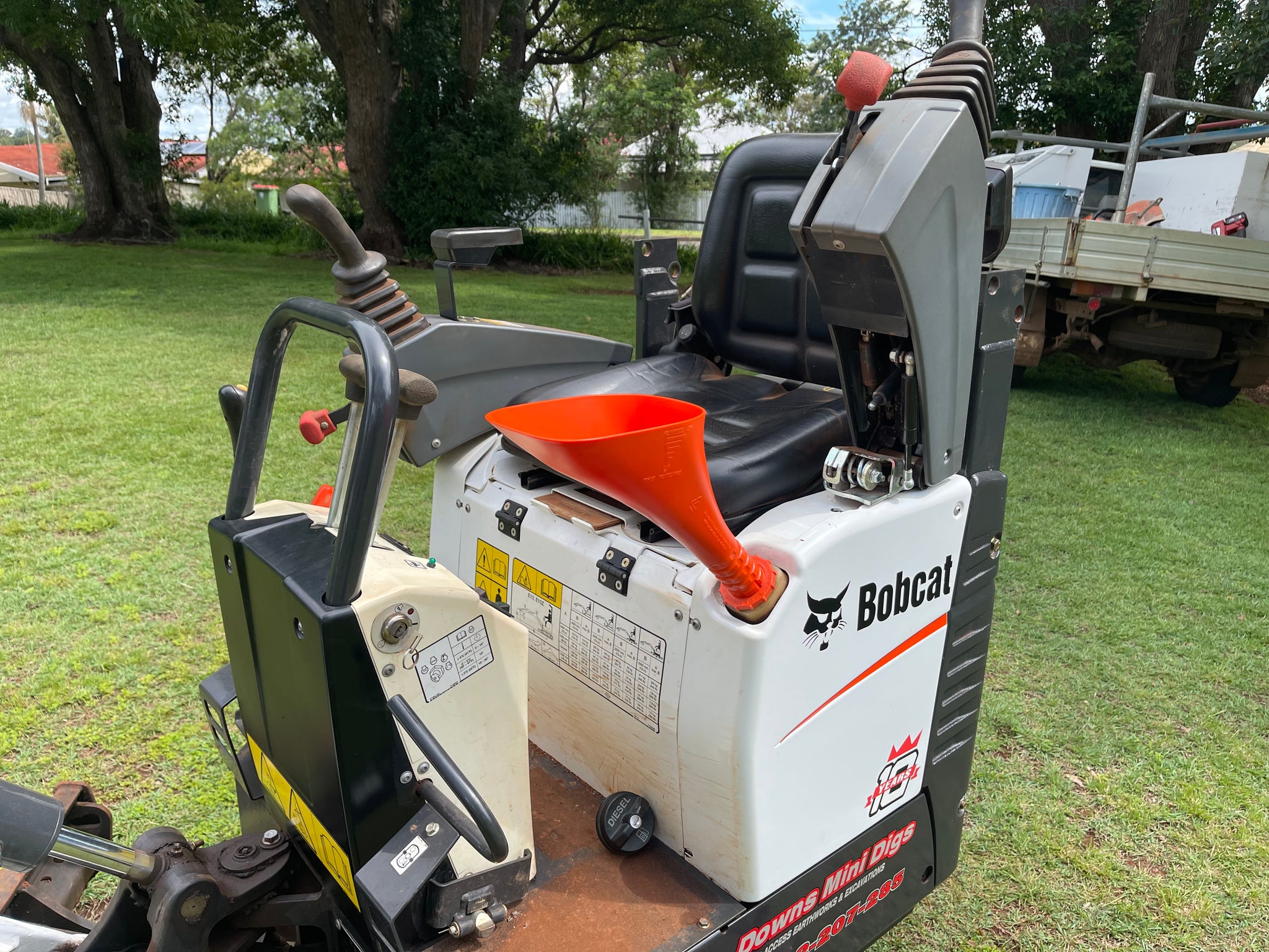Safety Orange Scrunnel, refueling from jerry cans. Vehicle Funnel car ...