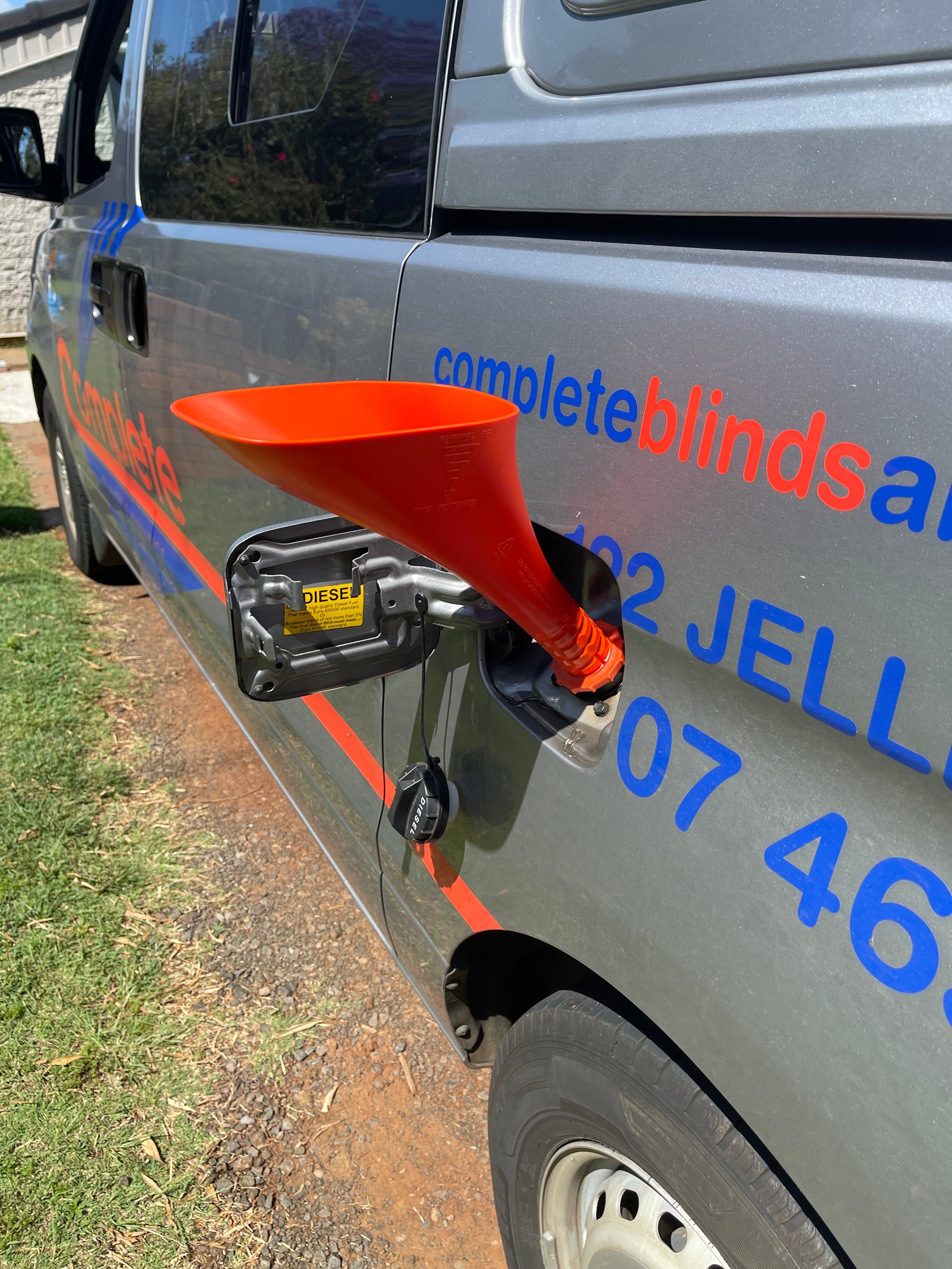 Safety Orange Scrunnel, refueling from jerry cans. Vehicle Funnel car ...